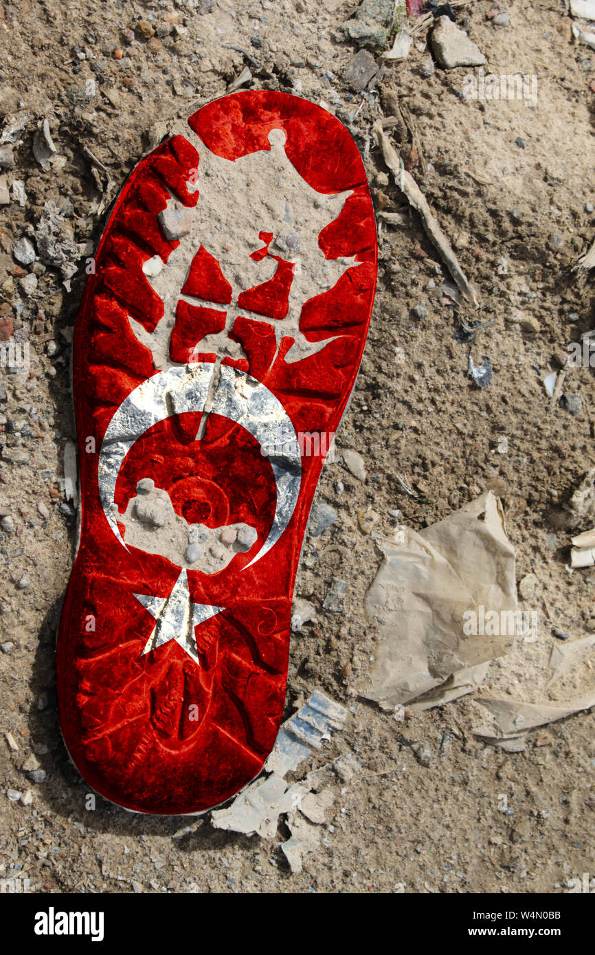 The flag of Turkey is depicted on the sole of an old boot. Ecology ...