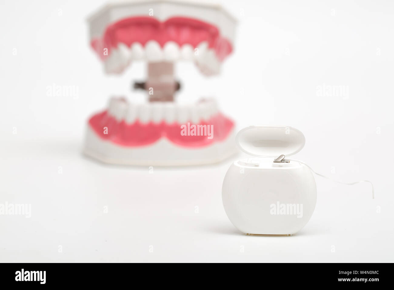 dental floss on white background Stock Photo - Alamy