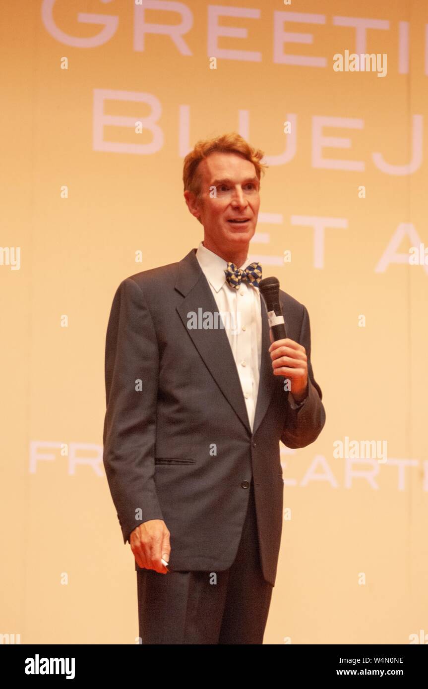 Three-quarter length shot of science communicator Bill Nye, holding a ...