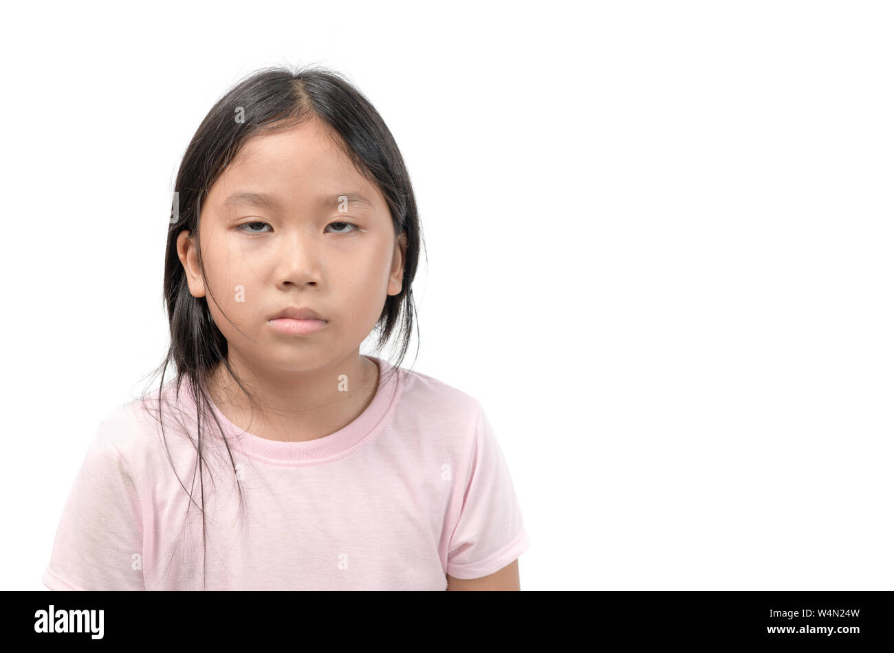 Little asian girl bored isolated on white background with copy space ...
