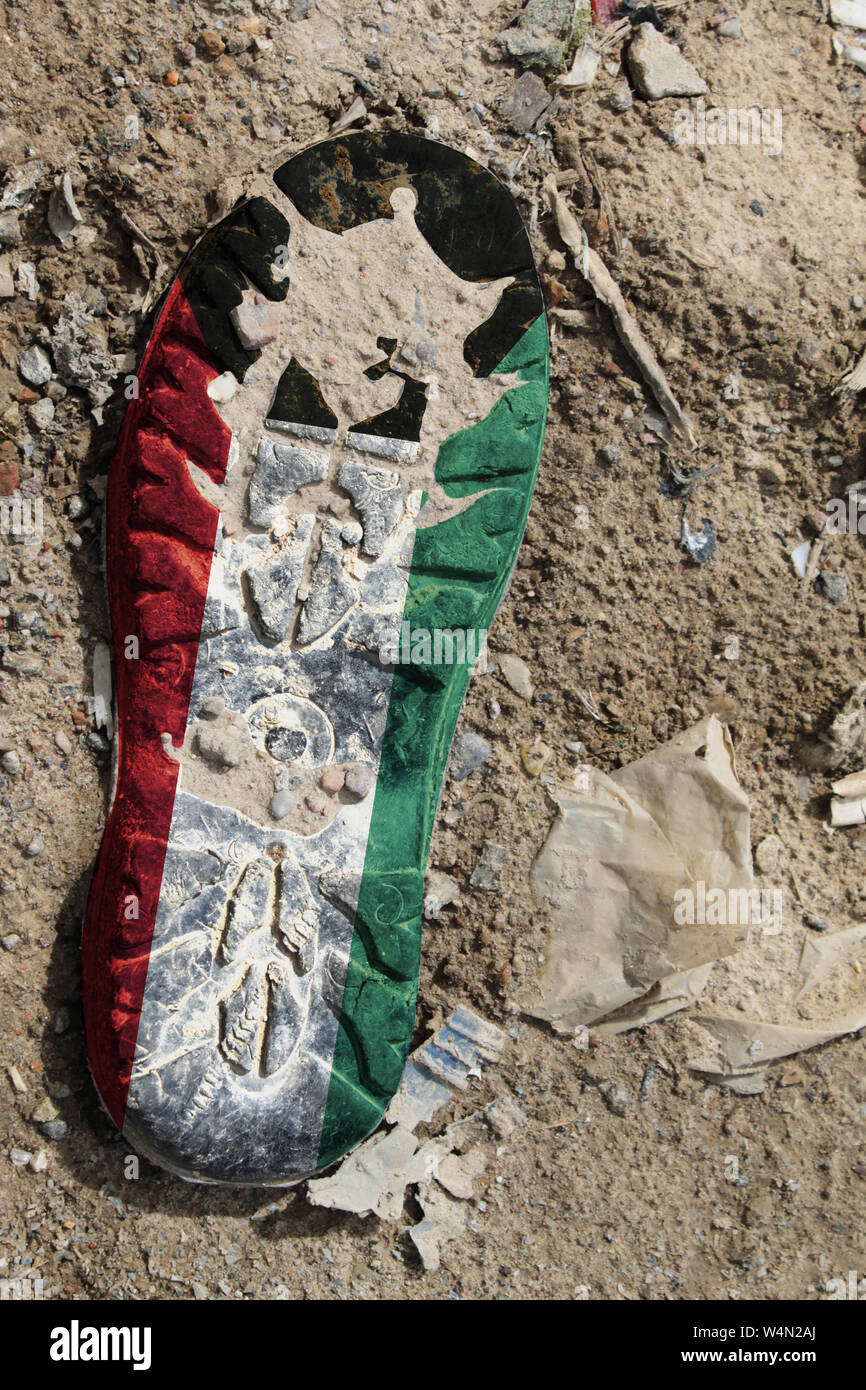 The flag of Kuwait is depicted on the sole of an old boot. Ecology ...