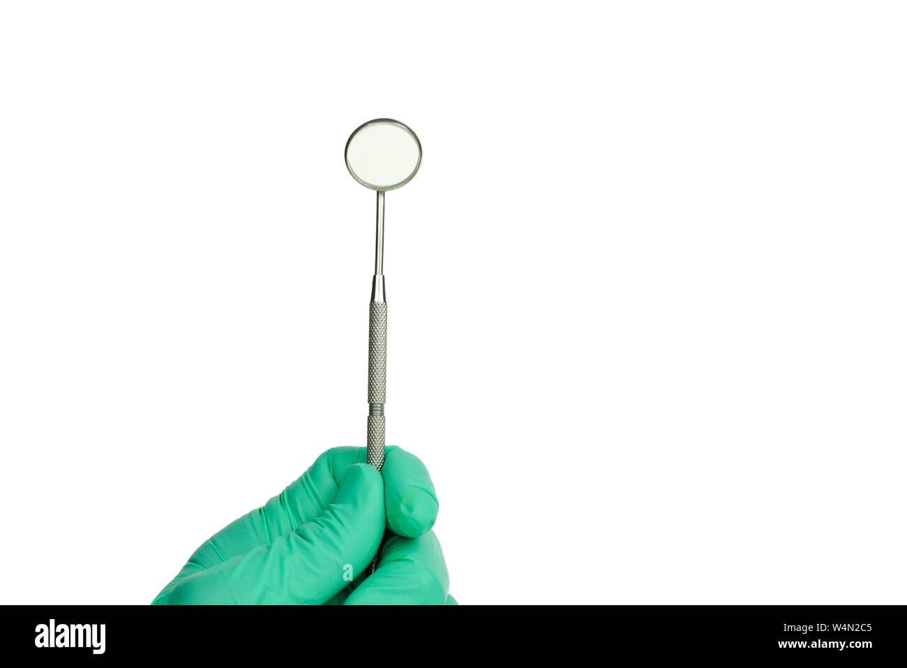 dentist hand holding mirror on white background Stock Photo - Alamy