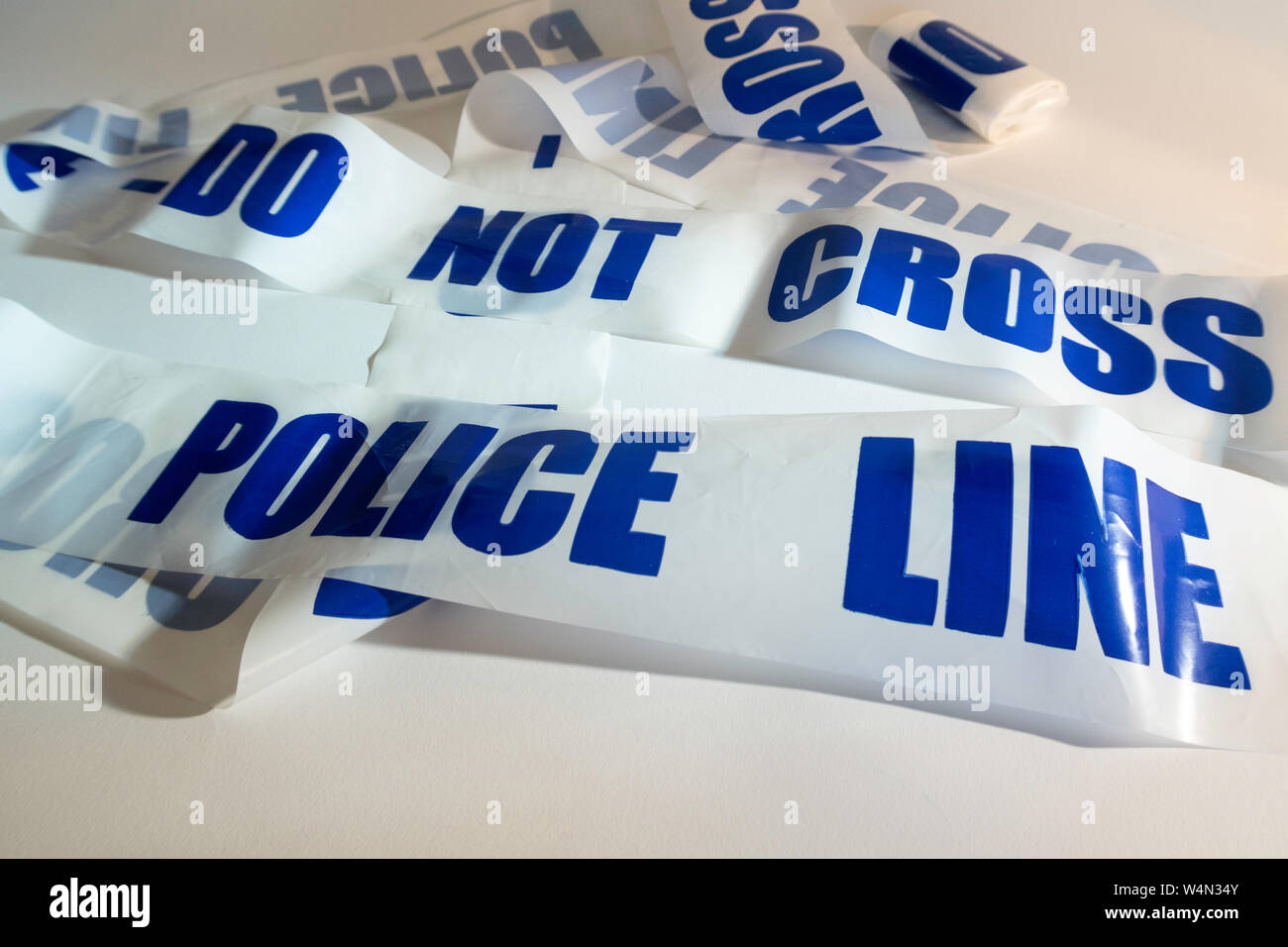 Blue and white police tape hi-res stock photography and images - Alamy