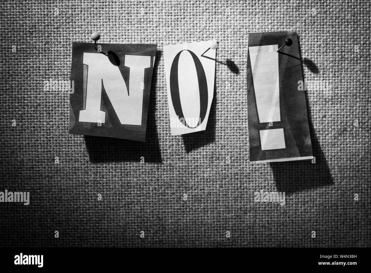 The word NO on a bulletin board using cut-out paper letters in the ...