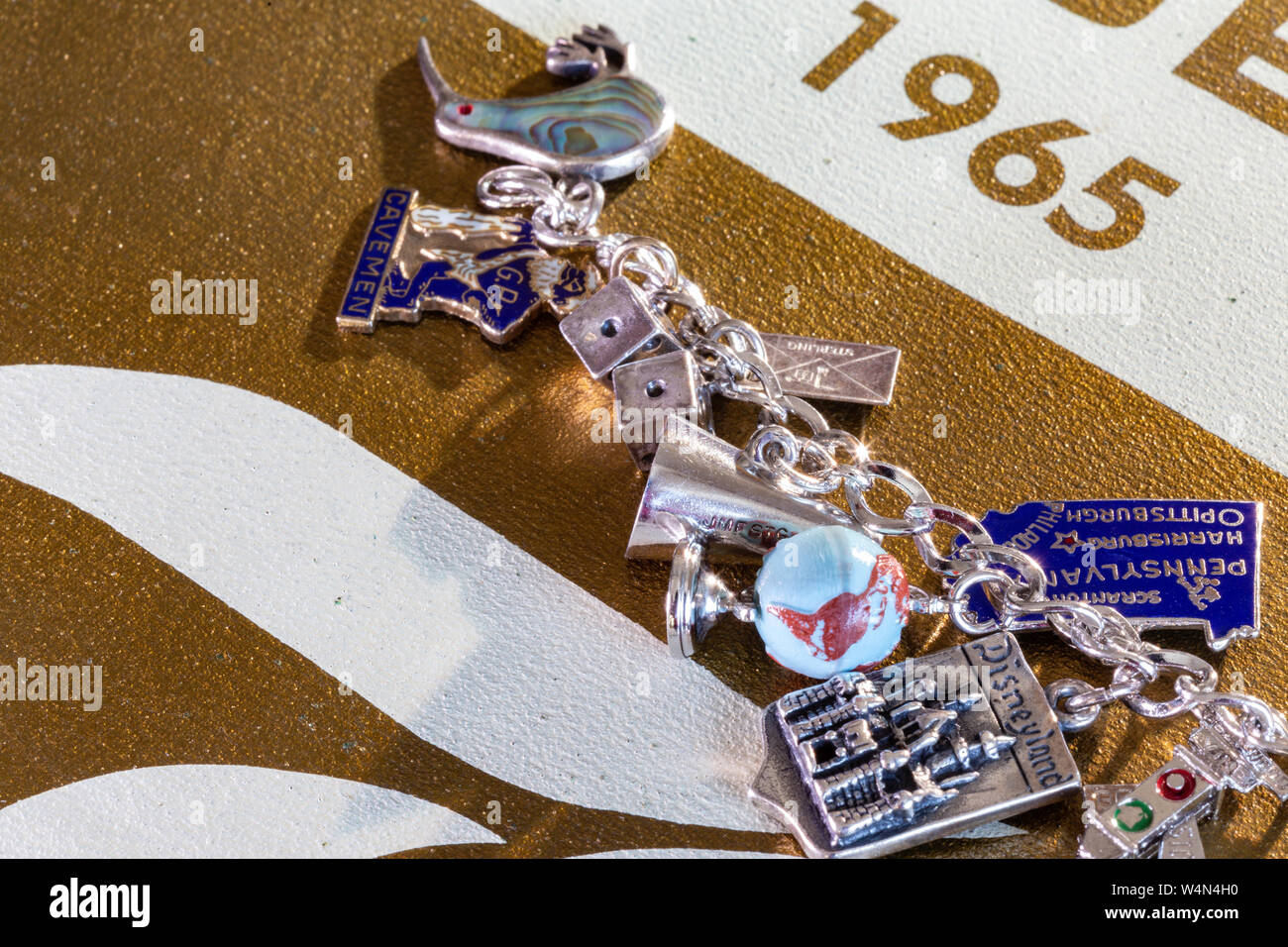 Close up of Charm Bracelet on a 1965 High School Yearbook, USA Stock ...