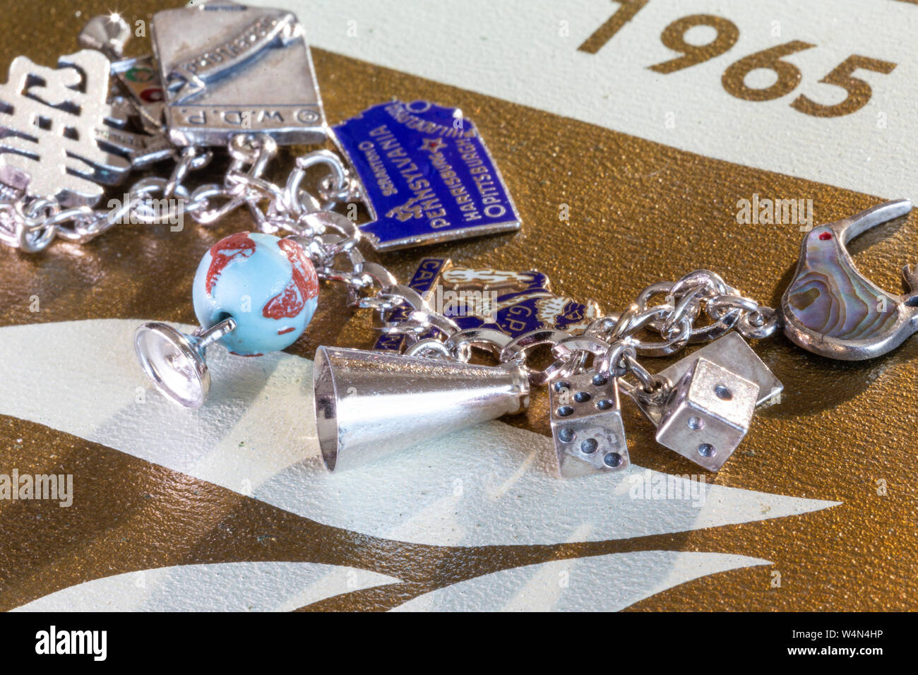 Close up of Charm Bracelet on a 1965 High School Yearbook, USA Stock ...