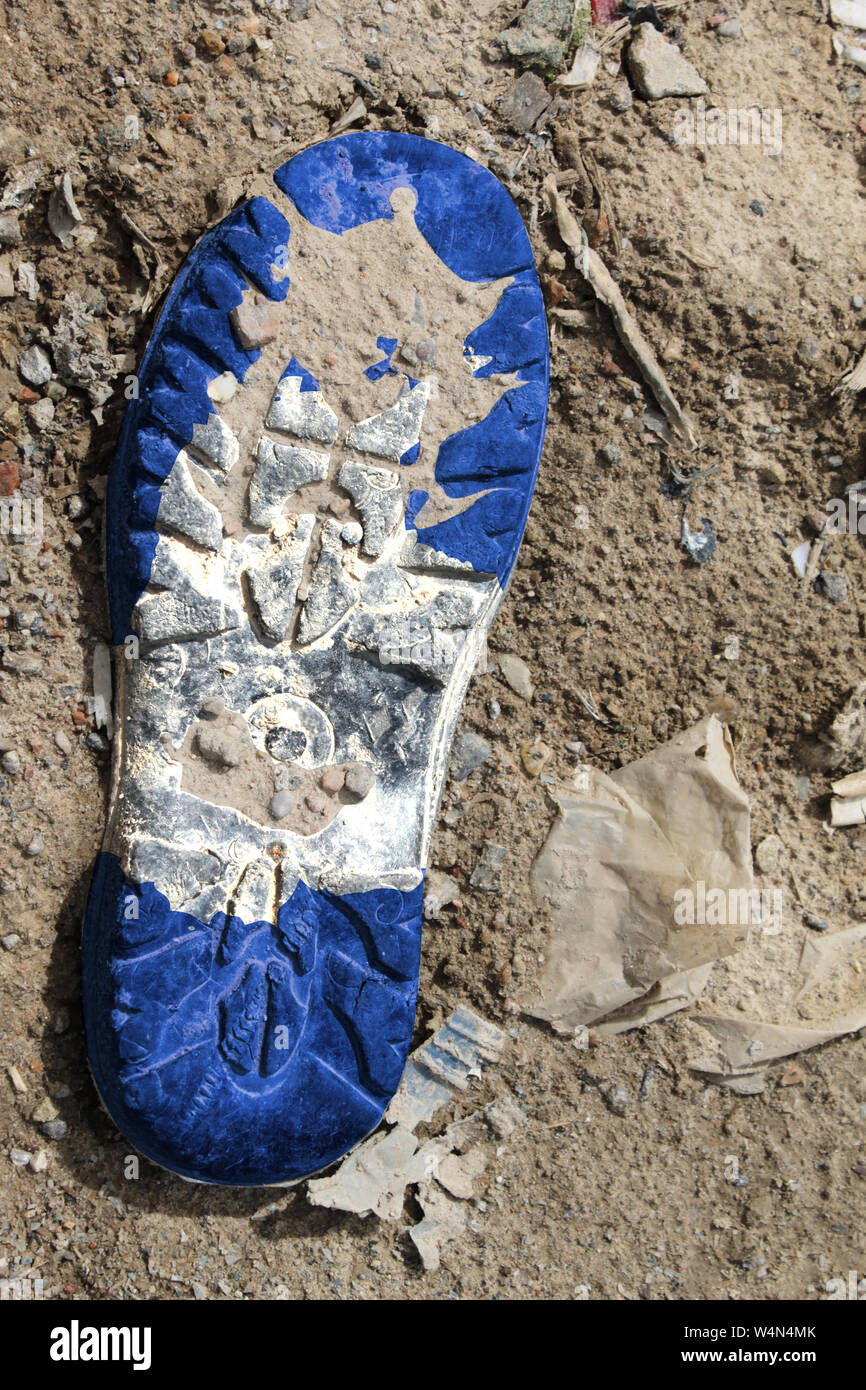The flag of Antarctic is depicted on the sole of an old boot. Ecology ...
