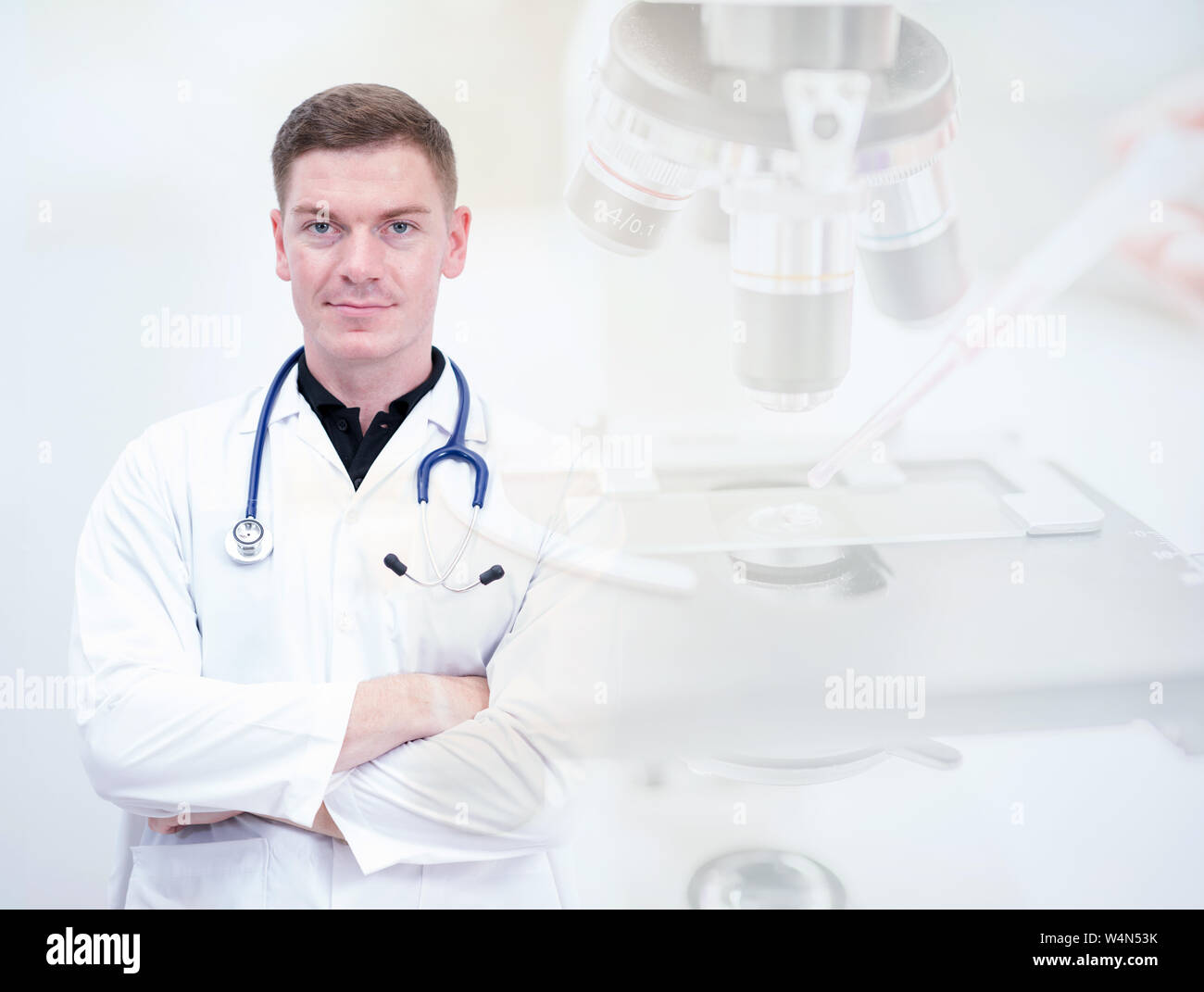 Microscope on the table in laboratory room with laboratory equipment ...