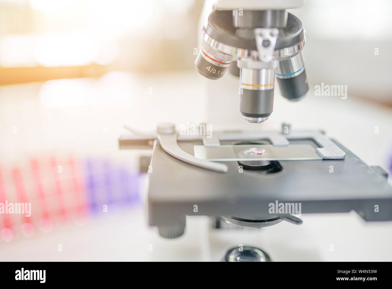 Microscope on the table in laboratory room with laboratory equipment ...