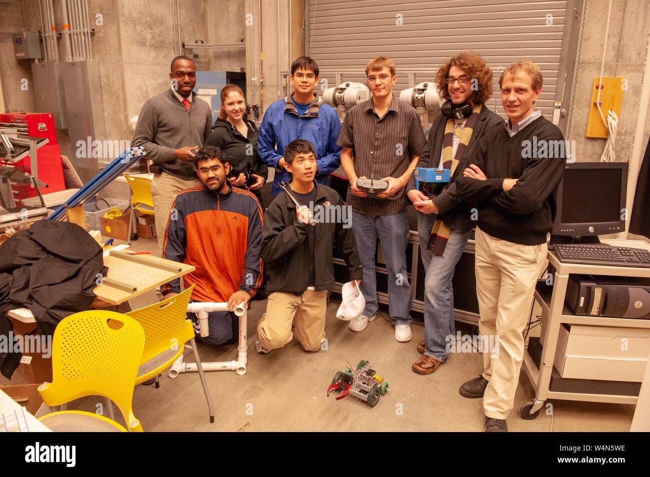 Members of the Johns Hopkins Robotics Club, pose together with a remote ...