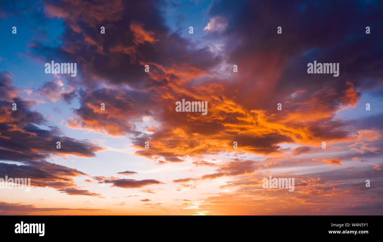 Dramatic orange sky with clouds at sunset Stock Photo - Alamy