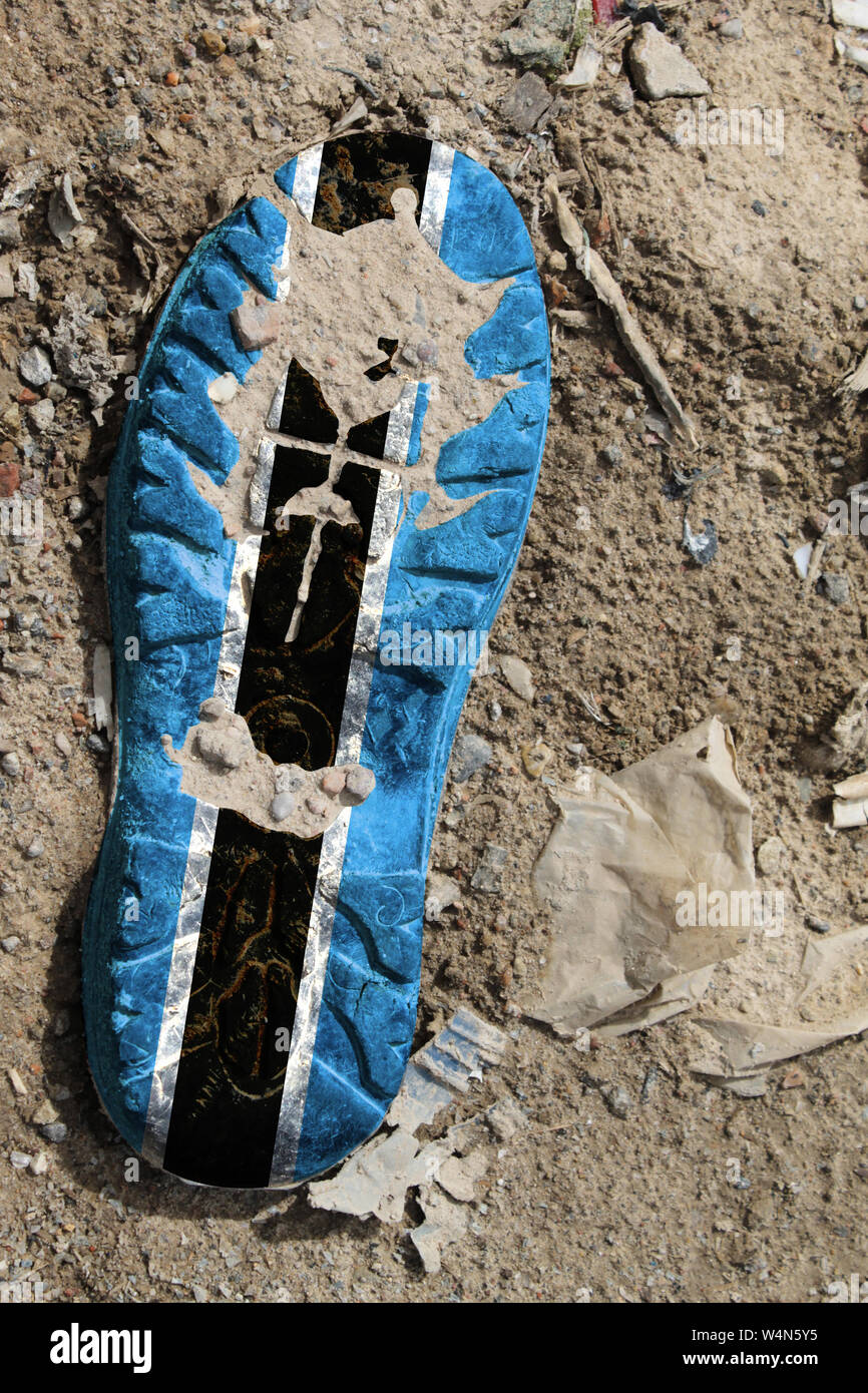 The flag of Botswana is depicted on the sole of an old boot. Ecology ...