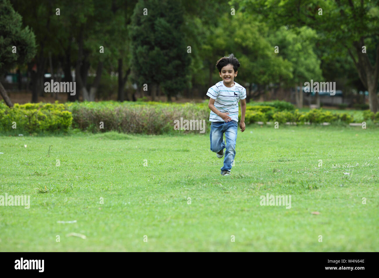 Indian boy running park hi-res stock photography and images - Alamy