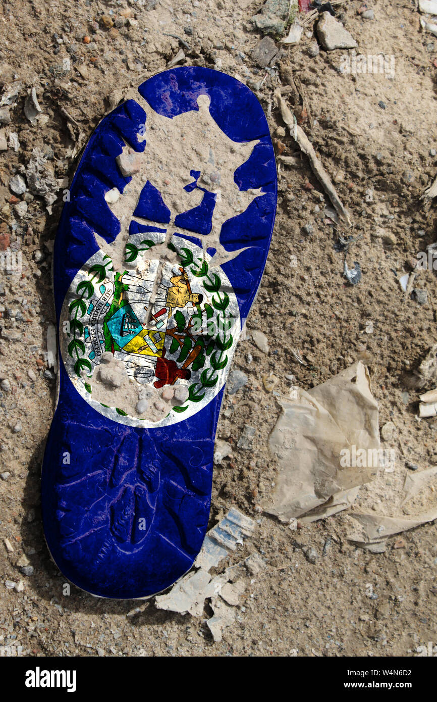 The flag of Belize is depicted on the sole of an old boot. Ecology ...