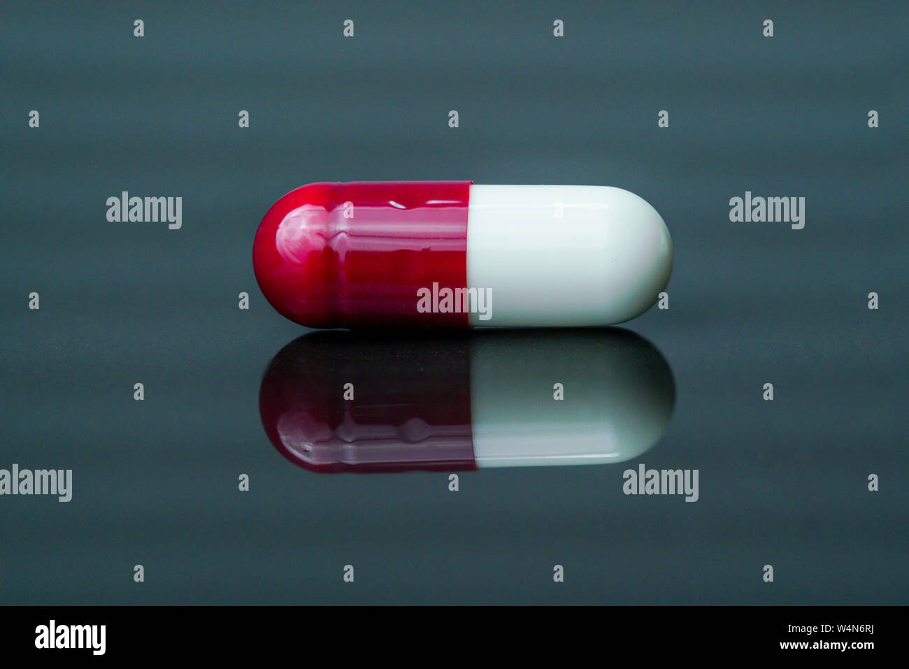 medical drug capsule on black background Stock Photo - Alamy