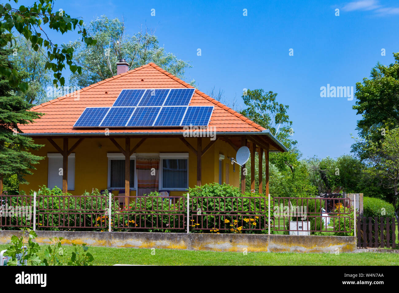 Holiday lodge home house with solar panels on roof, Balaton, Hungary ...