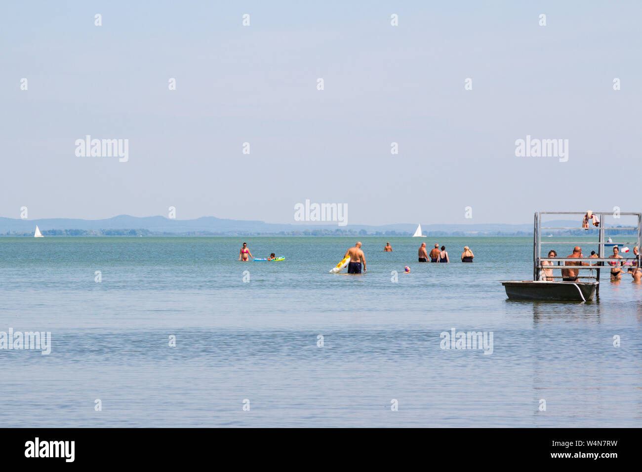 Bathers standing in shallow water of Lake Balaton, Hungary Stock Photo ...