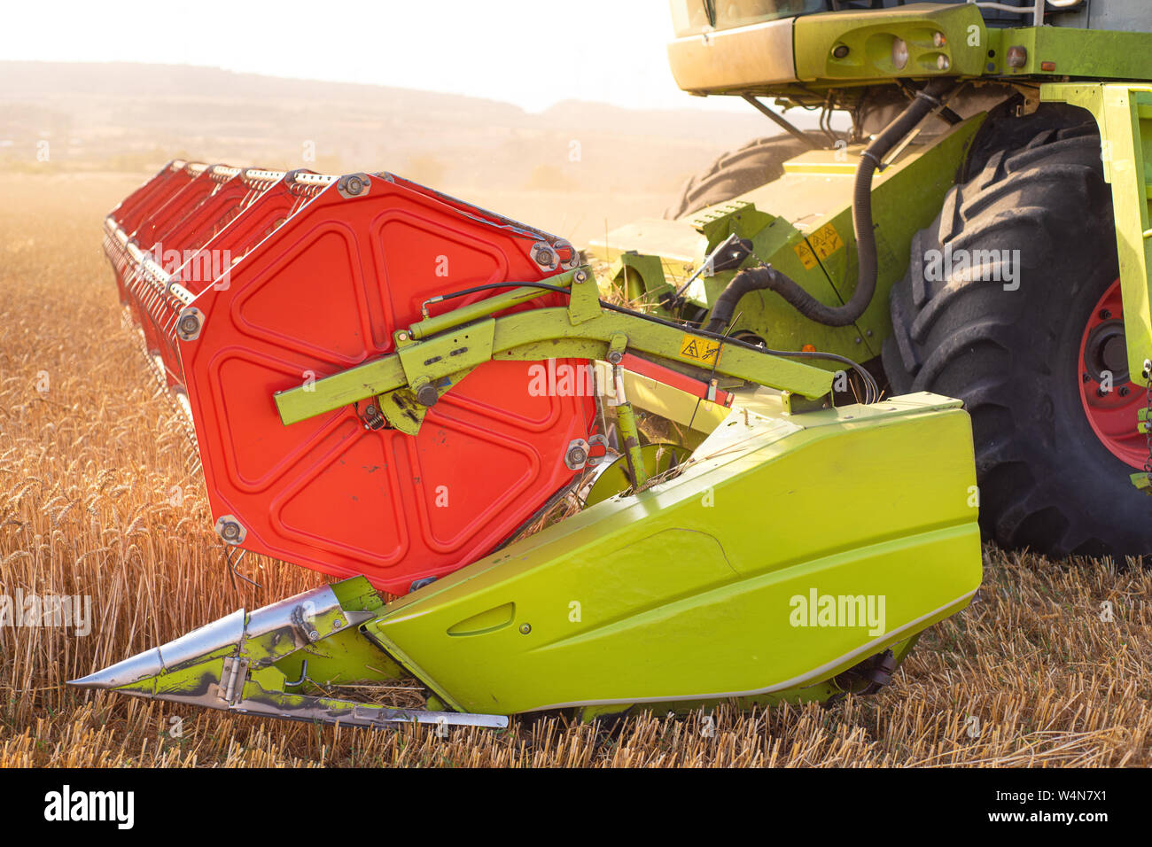 Combine harvester close up. Combine harvester harvesting wheat at ...
