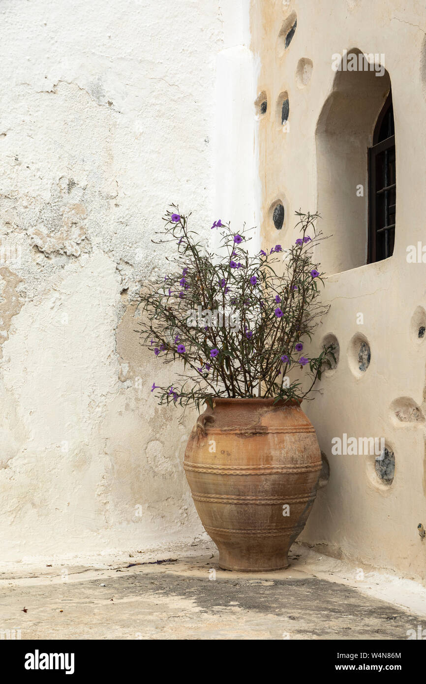 Terracotta planter and window in Emporio Santorini Stock Photo - Alamy