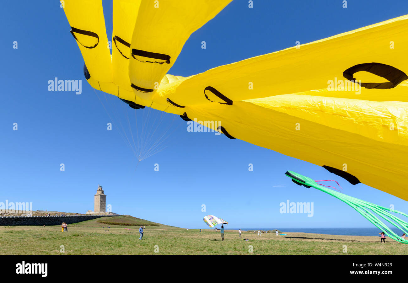 giant yellow octopus-shaped comet flying by the Hercules lighthouse in ...