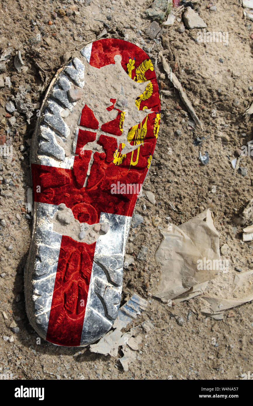 The flag of Sark is depicted on the sole of an old boot. Ecology ...