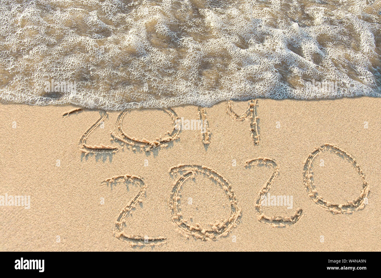 New year 2020 in beach sand at water's edge Stock Photo - Alamy