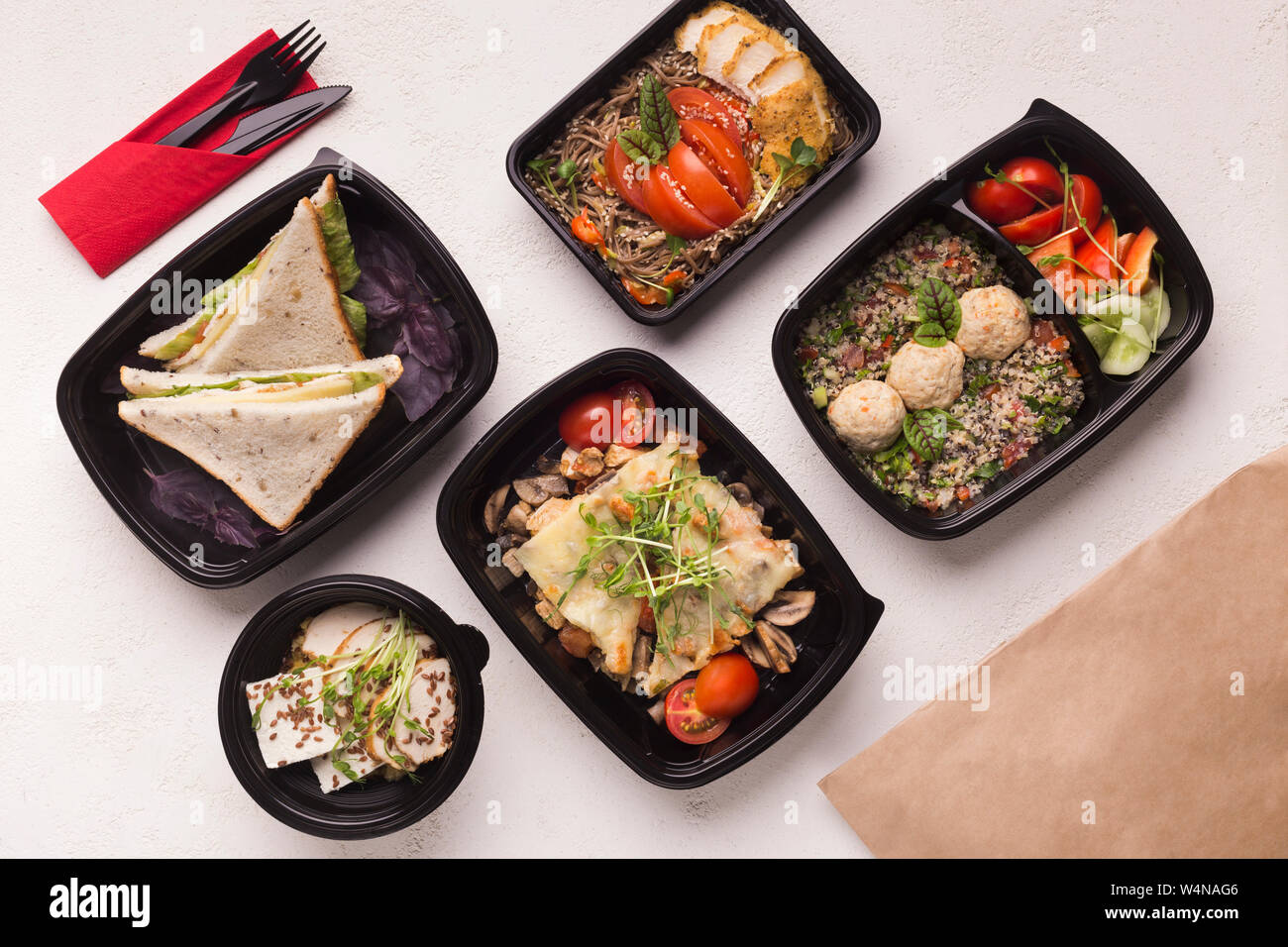 Healthy food in black boxes with daily ration Stock Photo - Alamy