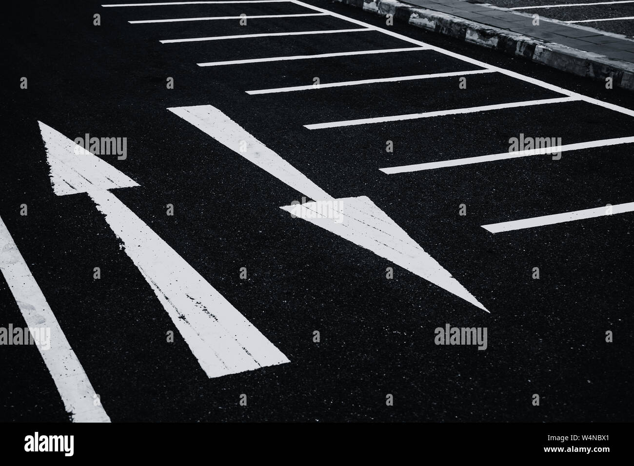 2 Ways two directions arrows paint on asphalt road. Conflicts Confusion ...