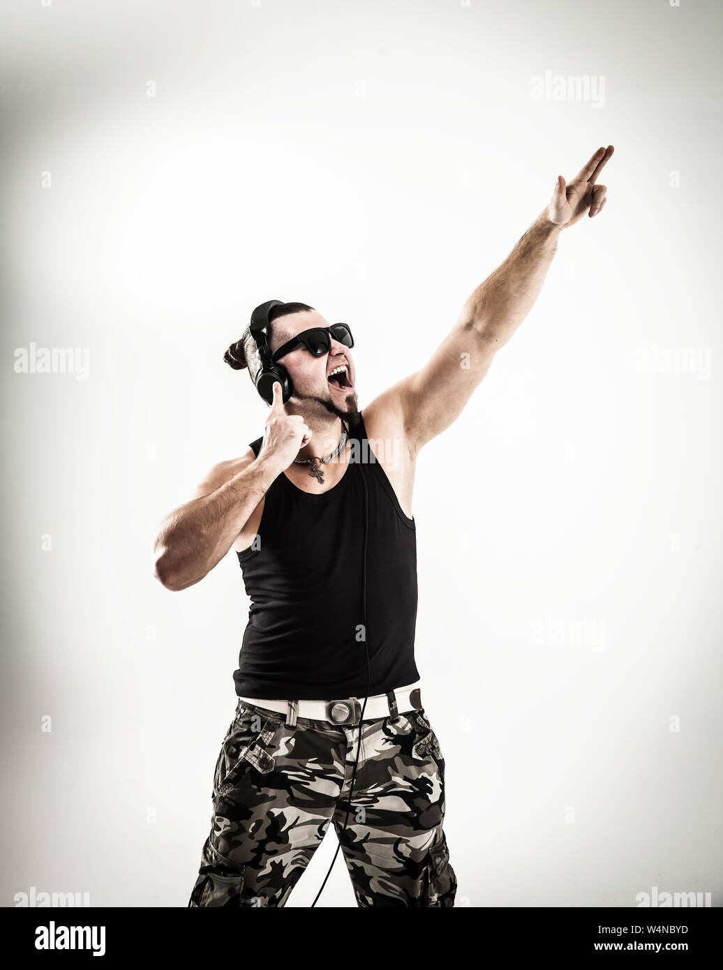 DJ - rapper in headphones takes the rap and break dancing dance on a ...