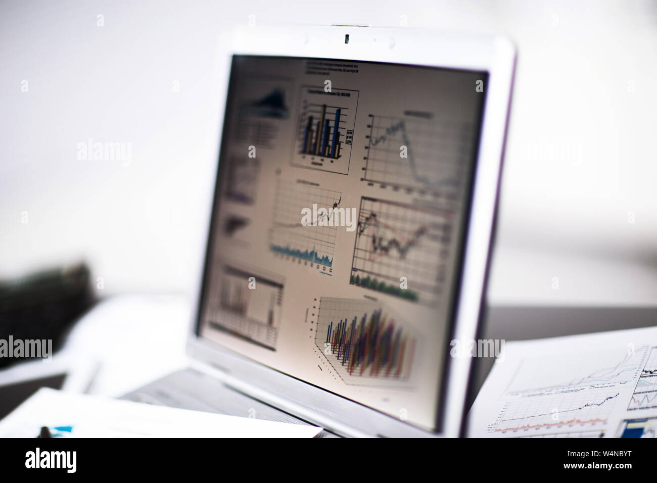 Businessman analyzing investment charts with laptop. Accounting Stock ...
