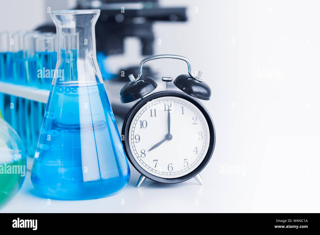 Time clock with Chemical Glassware for Medical Science Research in ...