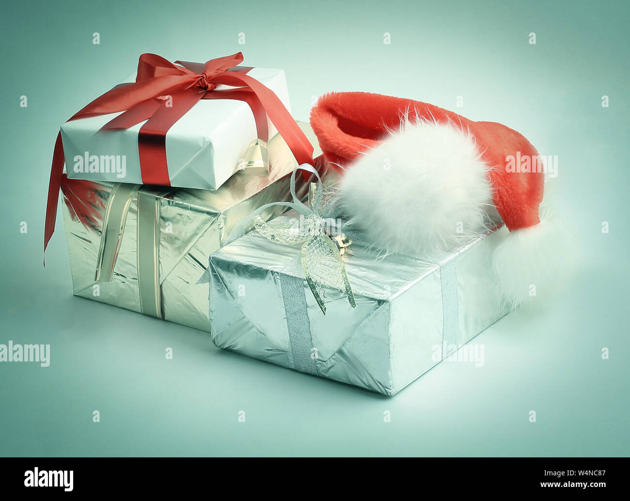 closeup.boxes with gifts and a Santa Claus hat.isolated on white ...