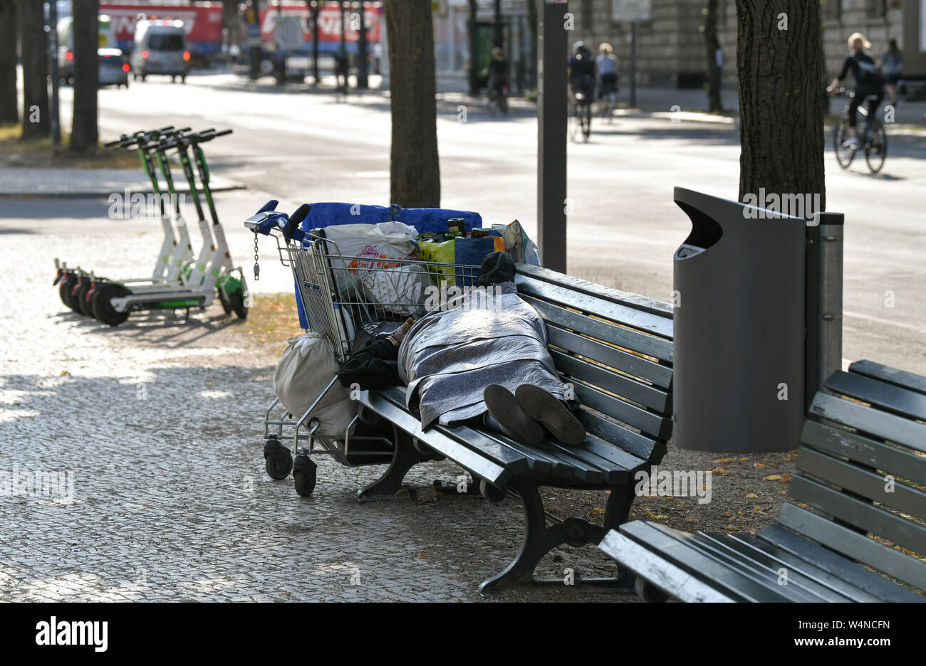 Berlin, Germany. 22nd July, 2019. A homeless man sleeps on a bench on ...