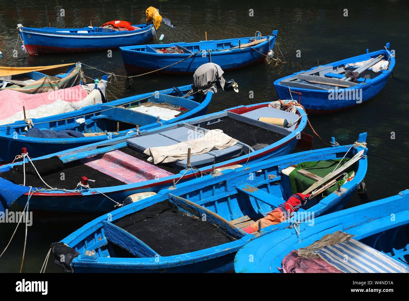 Blue traditional fishing boats in Mediterranean harbor of Bari, Italy ...