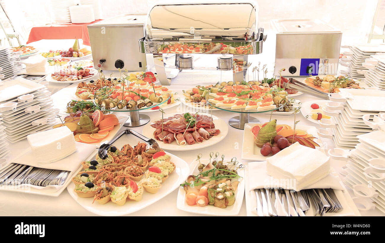 catering table set service with silverware and glass stemware at ...