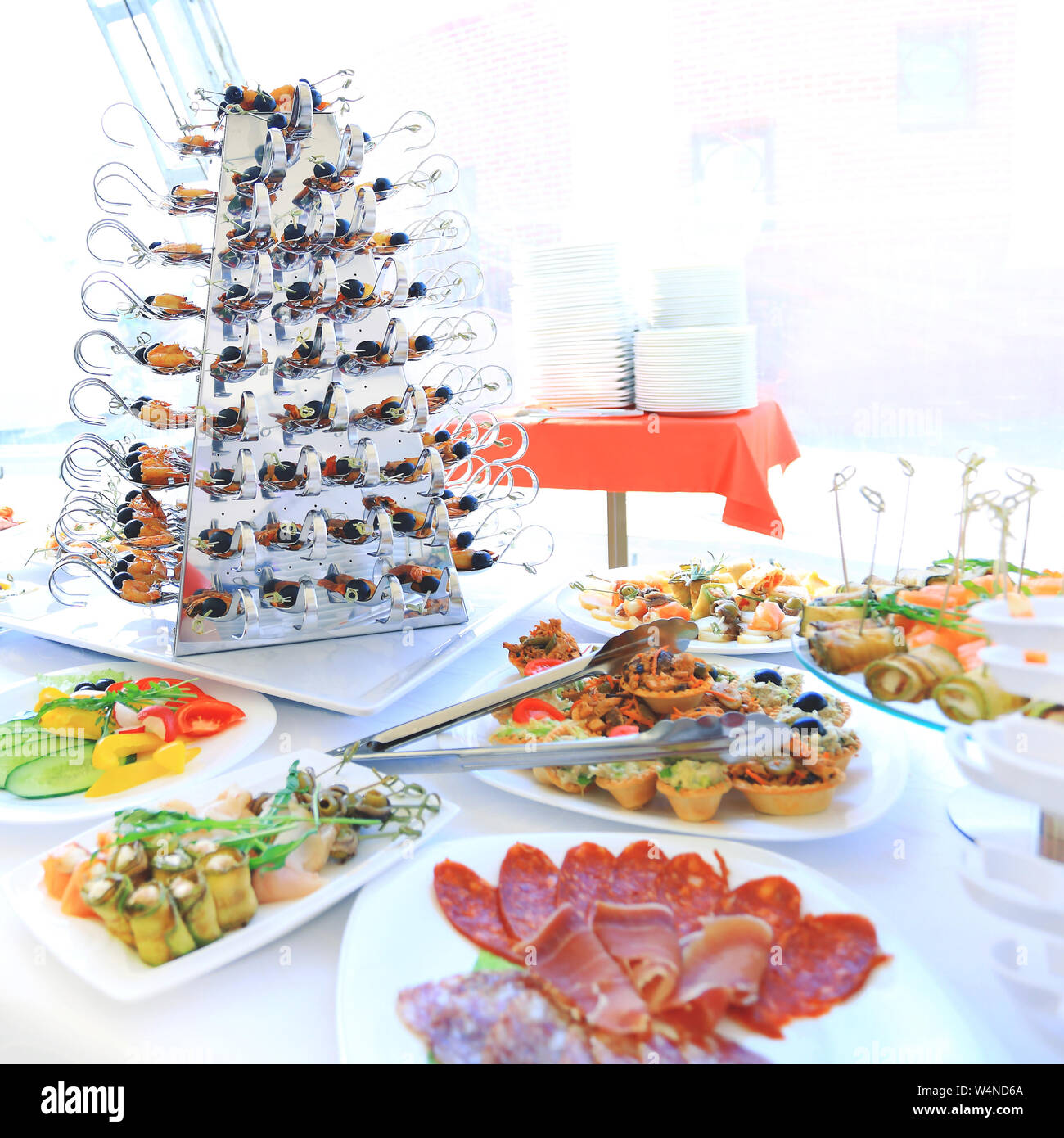 catering table set service with silverware and glass stemware at ...