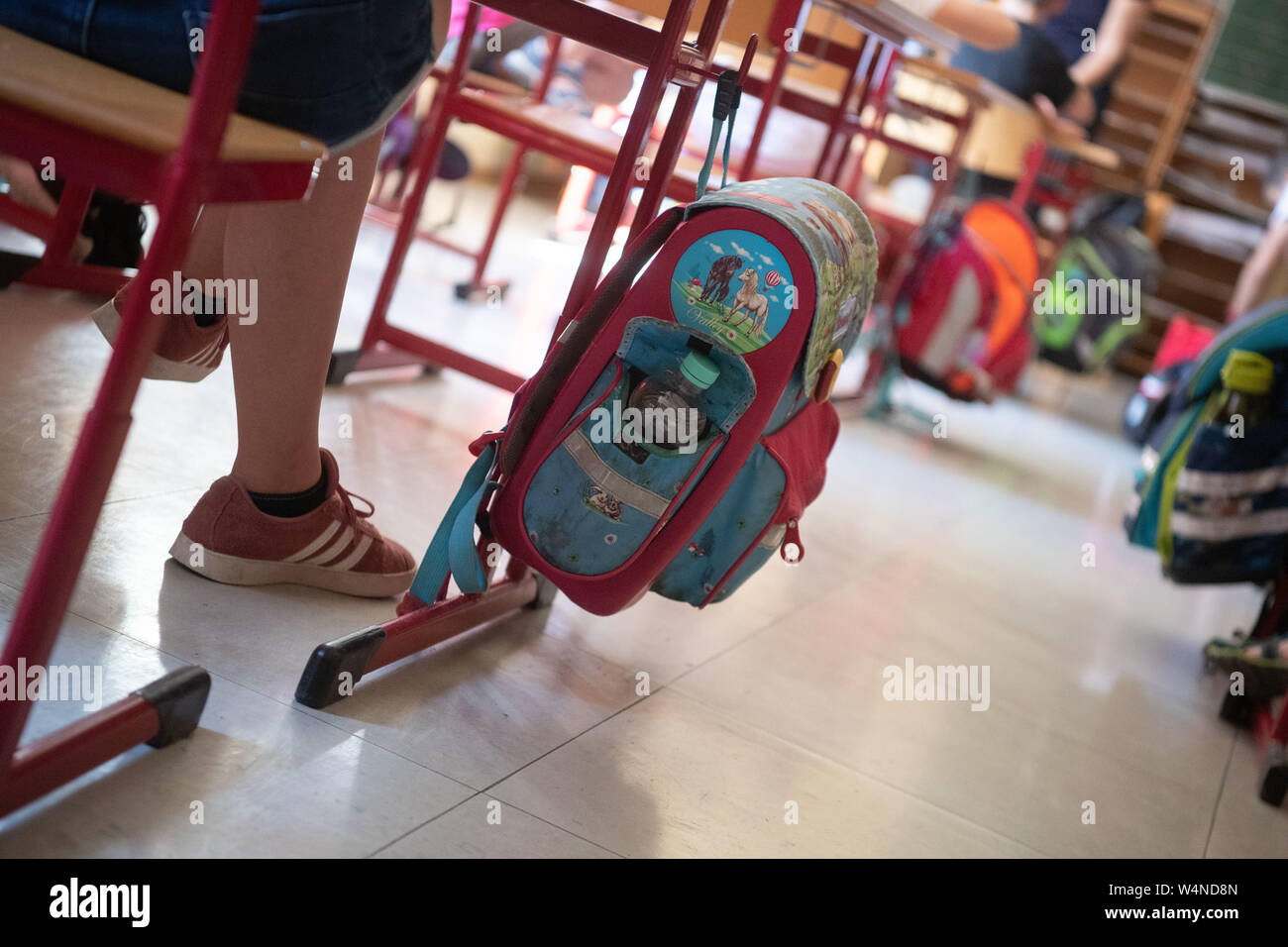 Lenningen, Germany. 23rd July, 2019. School satchels hang in the ...