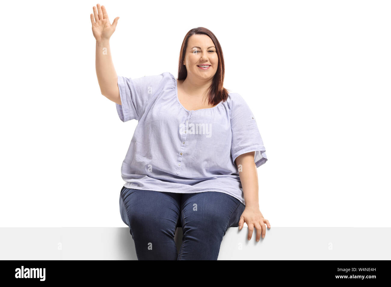 Plus size woman sitting on a panel and waving isolated on white ...