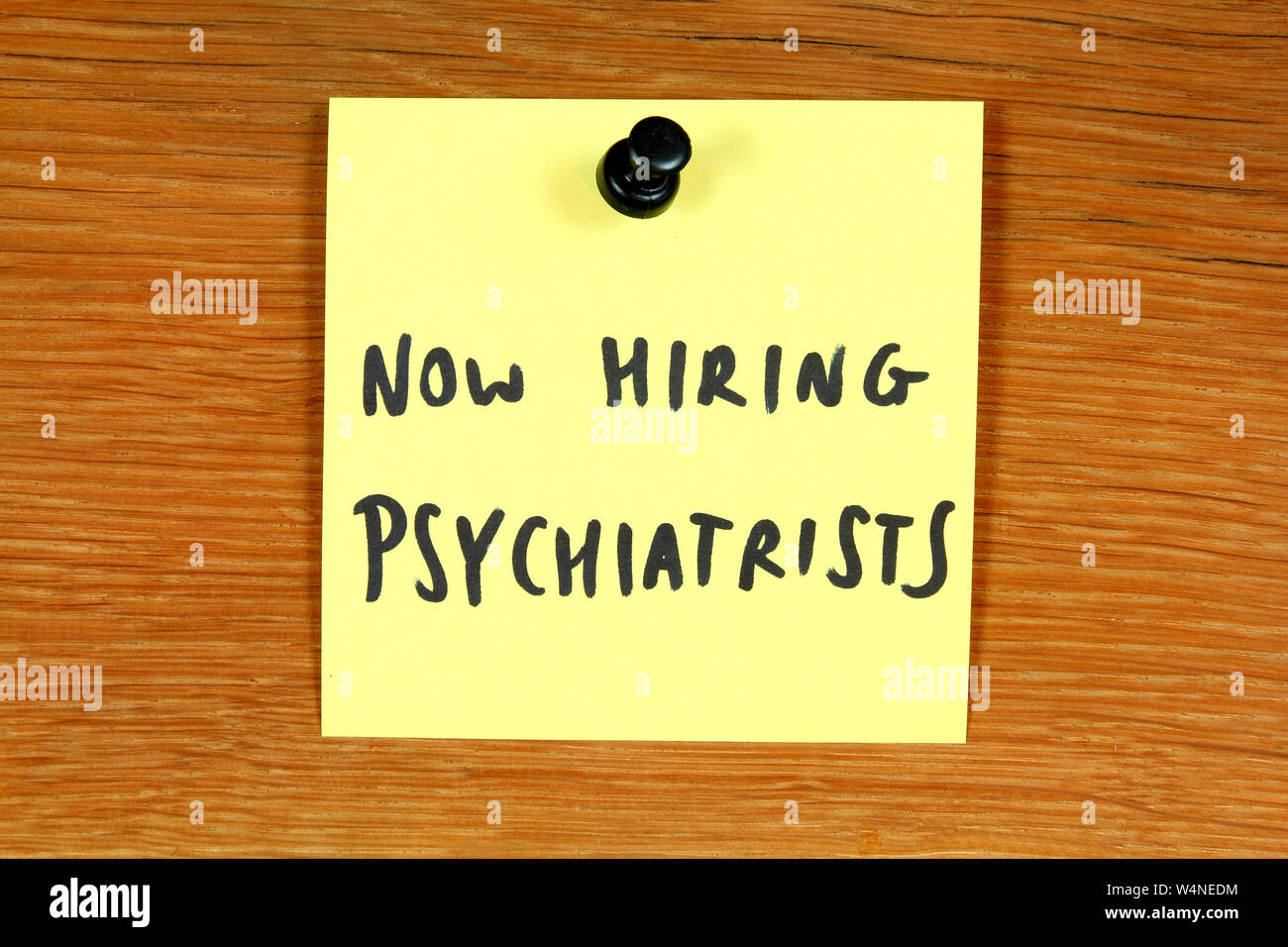 Sticky note with employment opportunity message - hiring psychiatrists ...