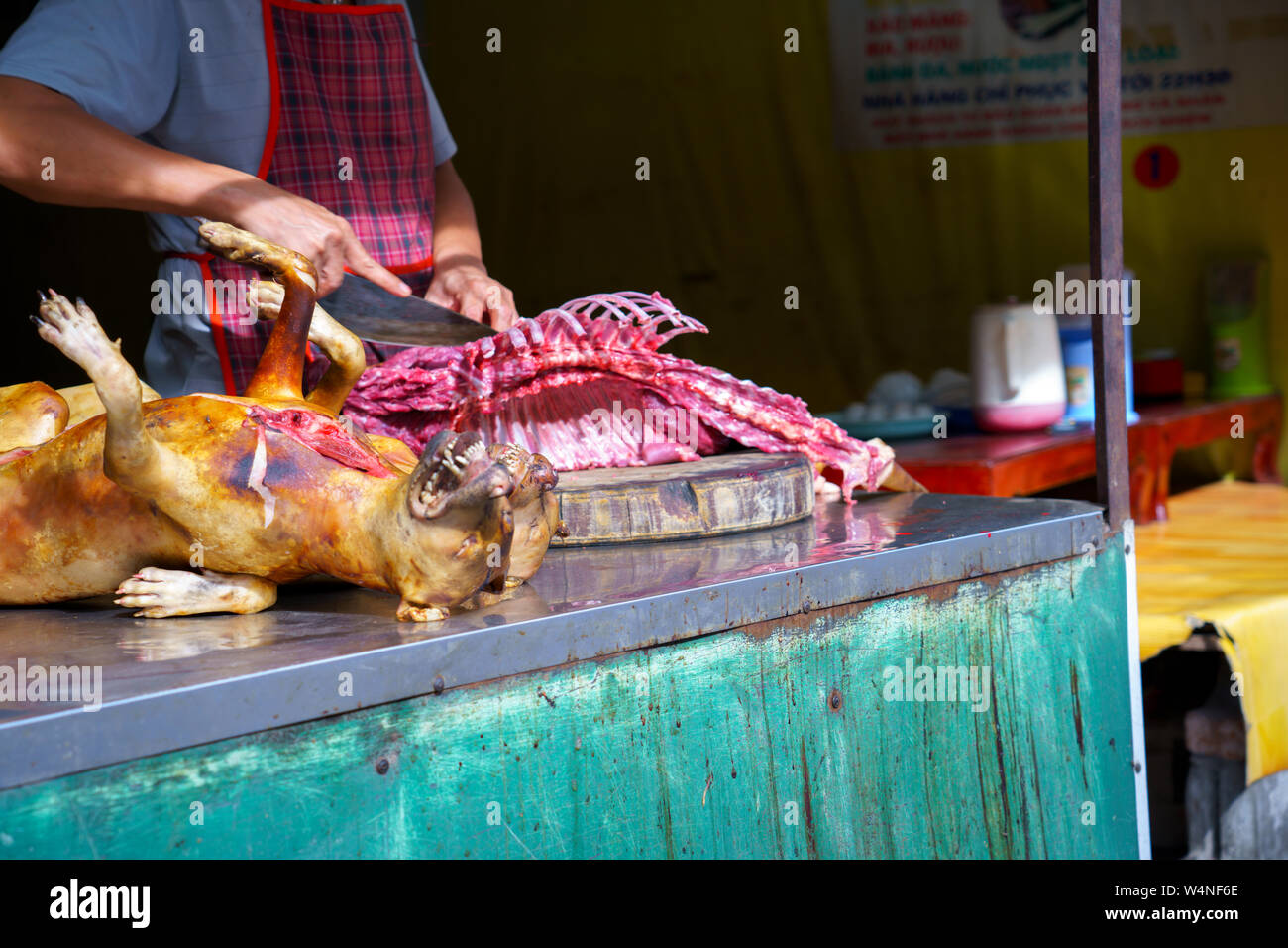 Man Dissected, pay Dog meat Dead body selling a grilled for barbecue ...