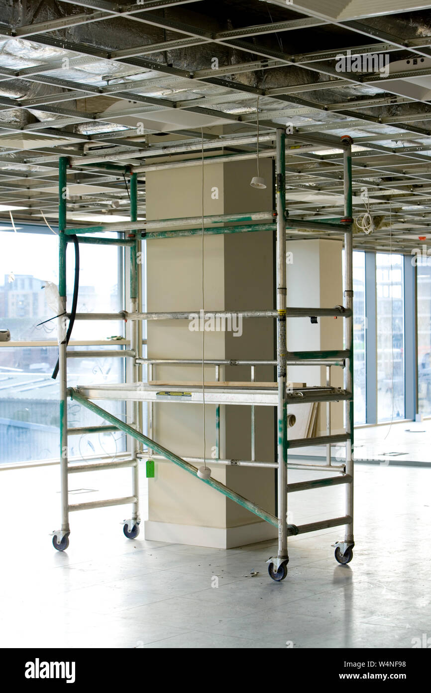Scaffold in office building Stock Photo - Alamy