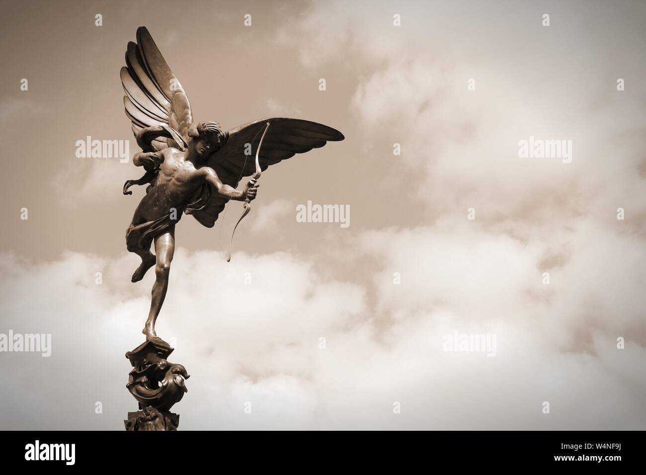 Eros statue at Piccadilly Circus in London, UK. Sepia tone - filtered ...