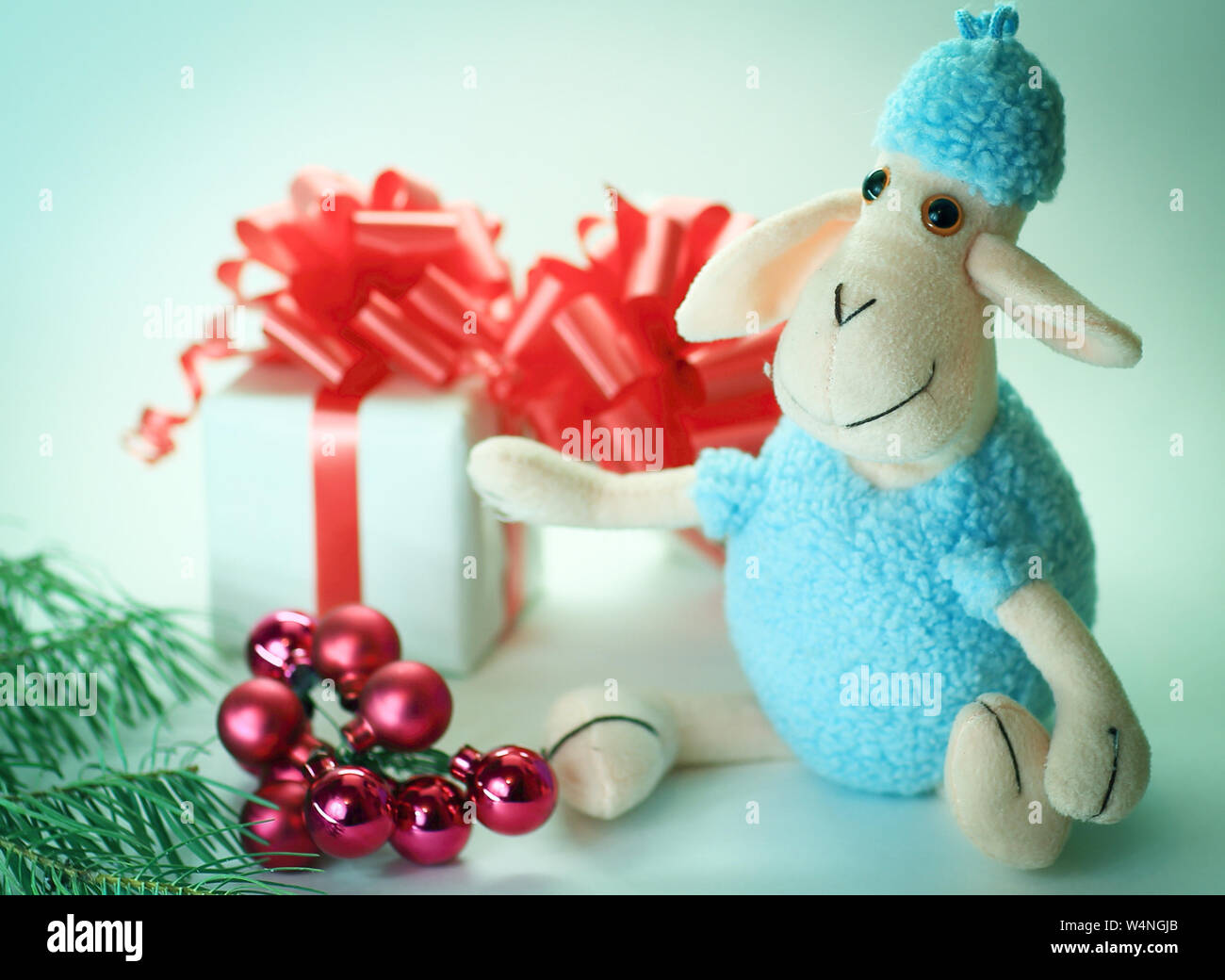 Christmas gifts and a toy sheep .isolated on white background.photo ...