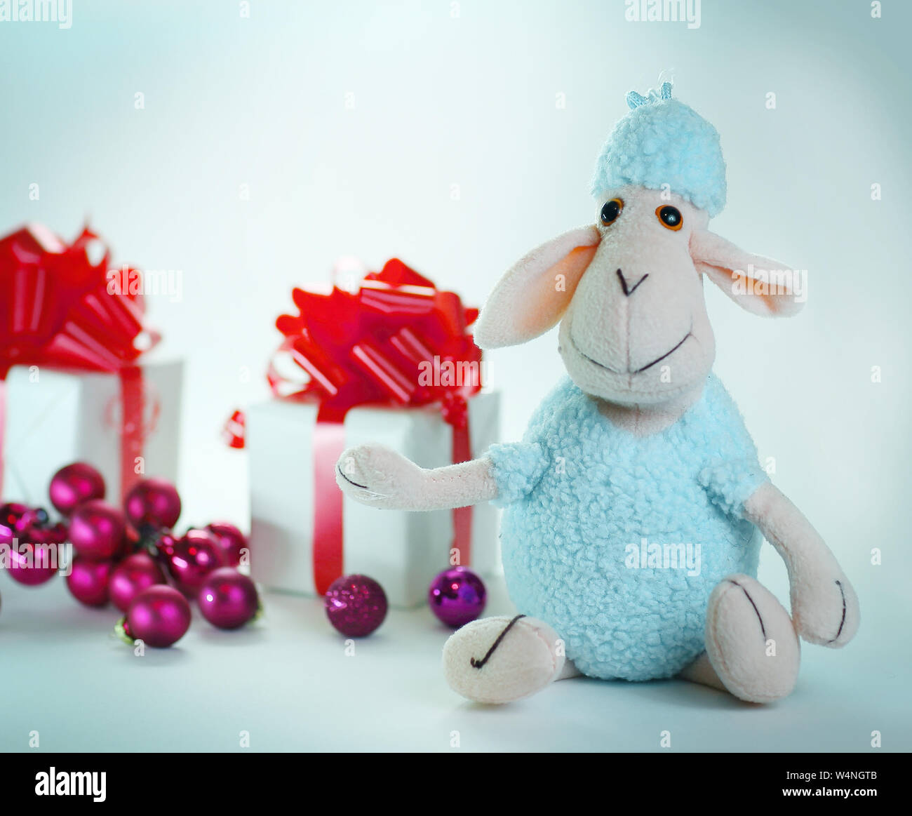 Christmas gifts and a toy sheep .isolated on white background.photo ...