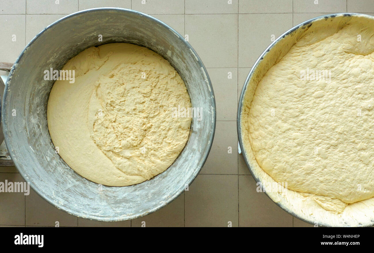 Closeup of yeast dough in production. yeast dough preparation process ...