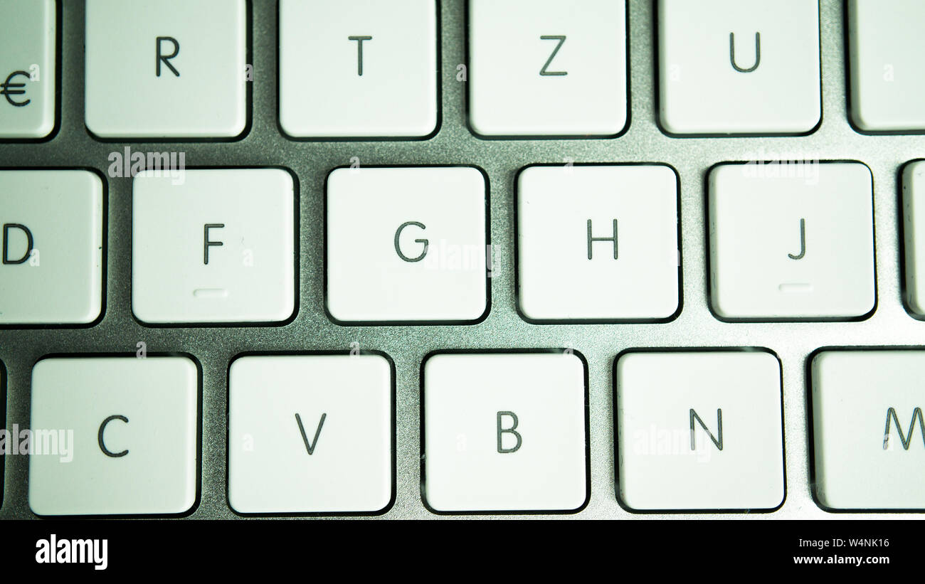 metallic keyboard with white keys Stock Photo - Alamy