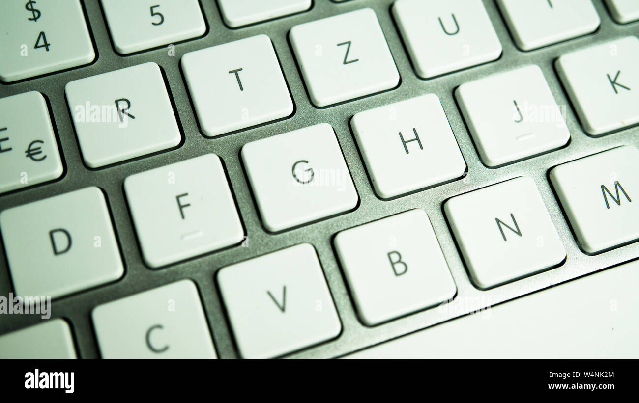 metallic keyboard with white keys Stock Photo - Alamy