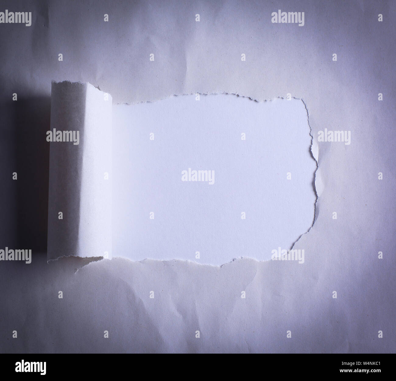 hole in the paper with torn edges.background.photo with copy space ...