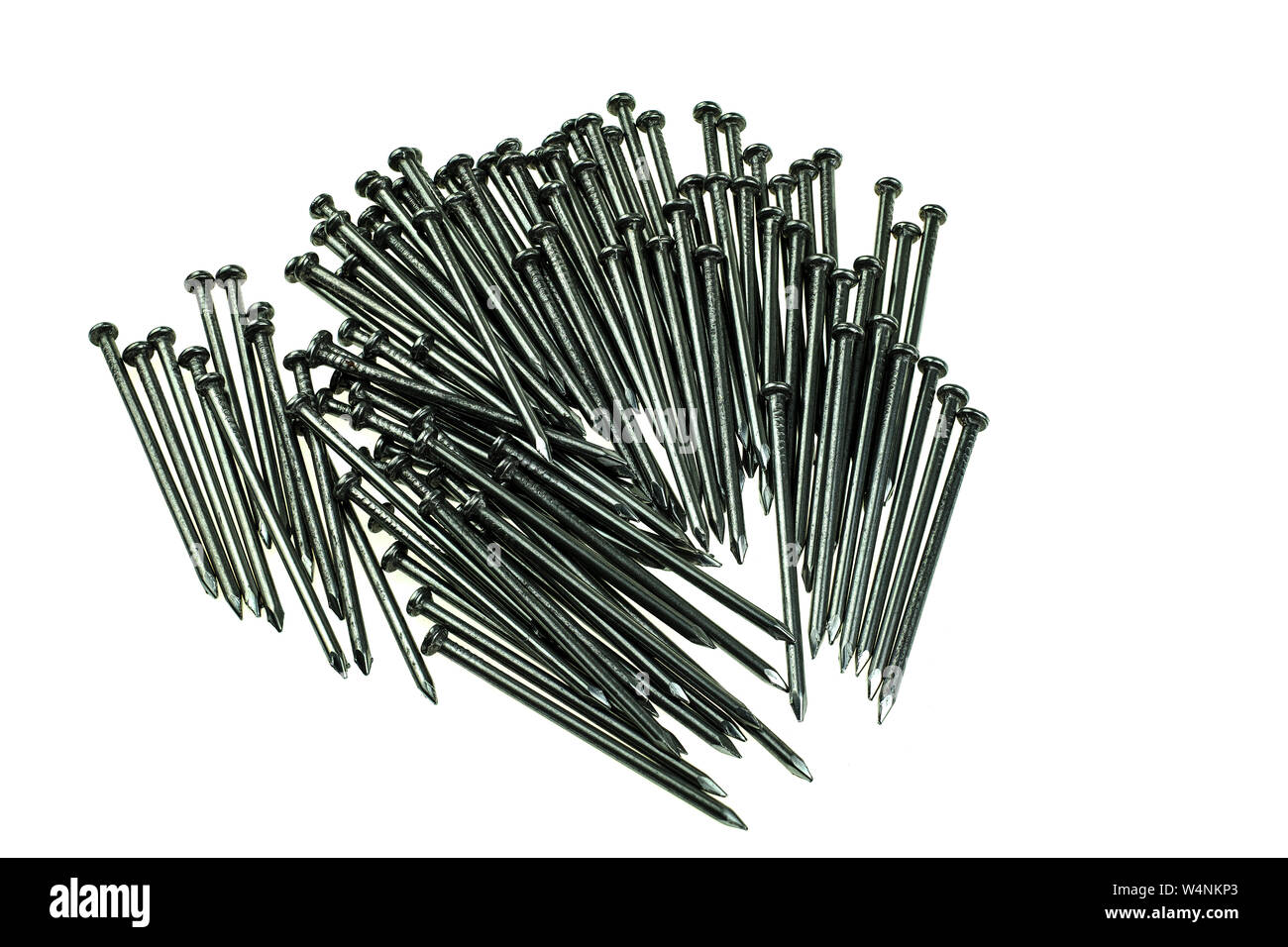Pile of iron nails at white background Stock Photo - Alamy