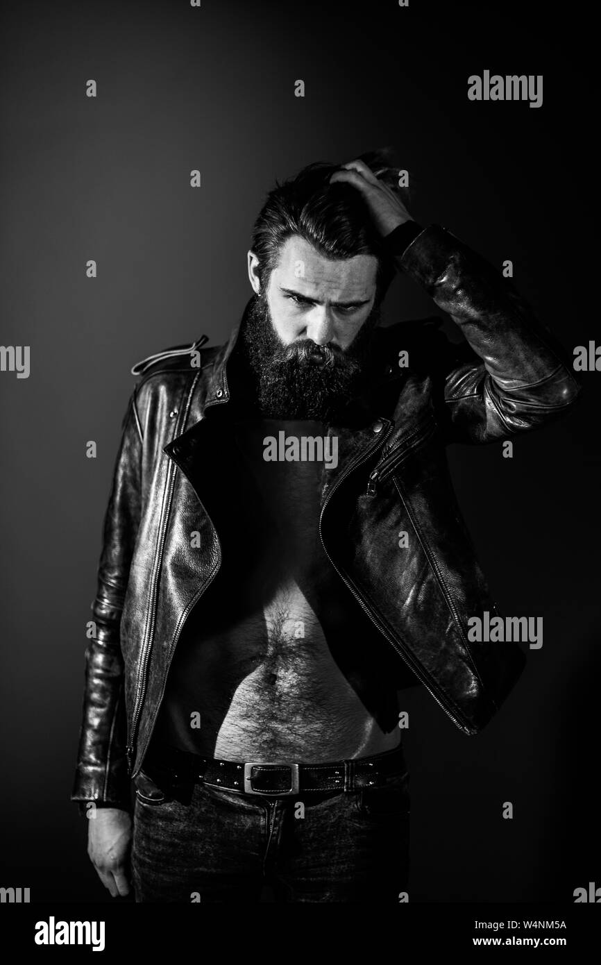 Brutal angry biker in the dark background Stock Photo - Alamy